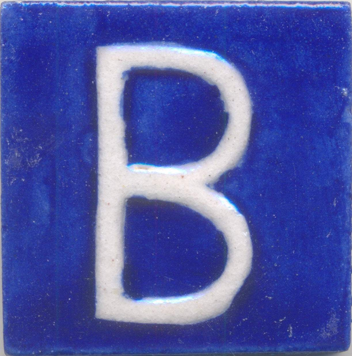 White B alphabet blue tile (2x2) – NEERJA INTERNATIONAL INC